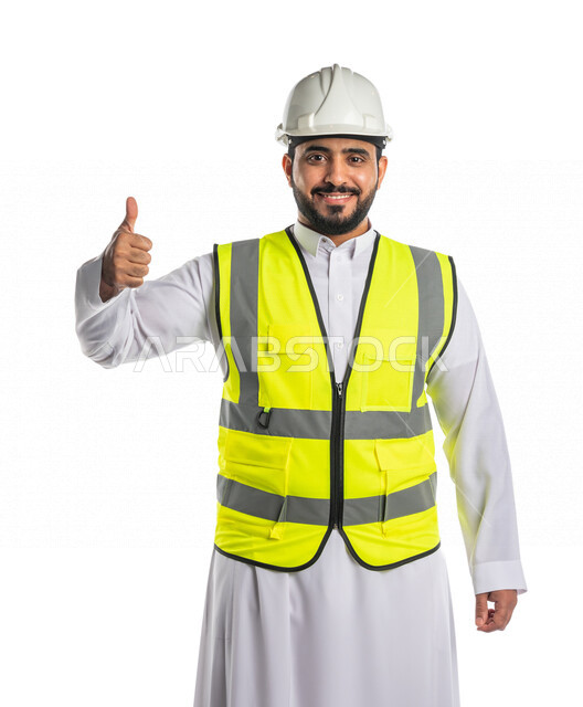 Portrait of a Saudi Arabian Gulf engineer wearing a helmet and work ...