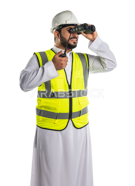 Portrait of a Saudi Arabian Gulf engineer wearing a work helmet and ...