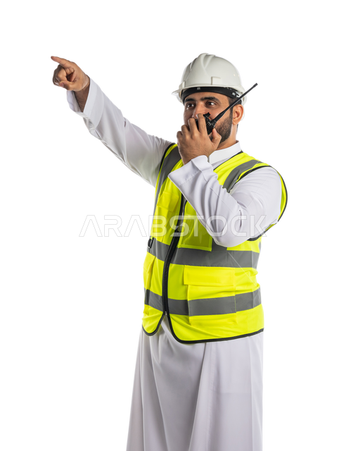 Portrait of a Saudi Arabian Gulf engineer wearing a work helmet and ...