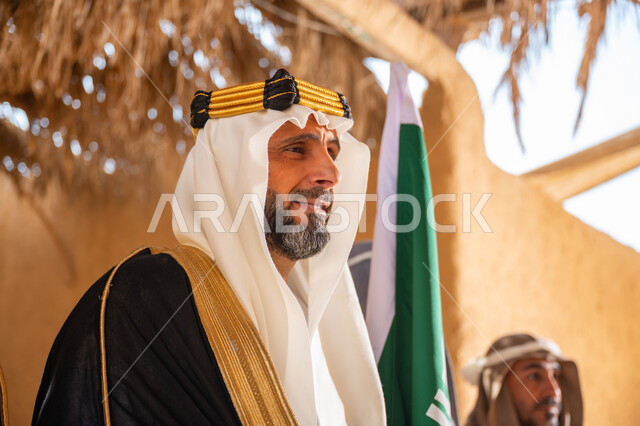 Wearing traditional costume on a national occasion, the flag of the ...