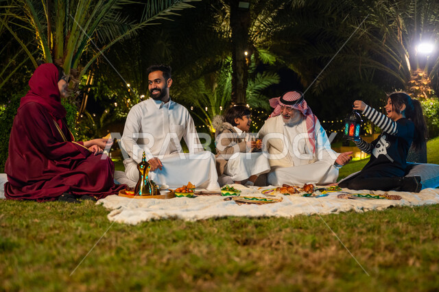 Family gathering at the dining table, concept of family bonding, Saudi ...