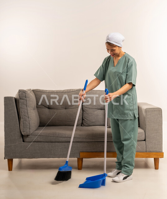 Routine household tasks and chores, portrait of a Filipino cleaning ...