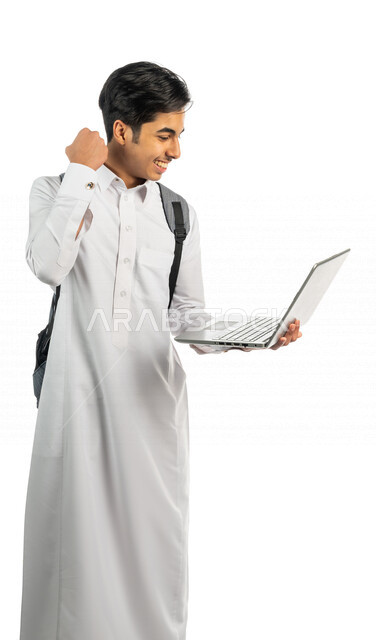 Portrait of a Saudi Arabian Gulf university student holding a laptop ...