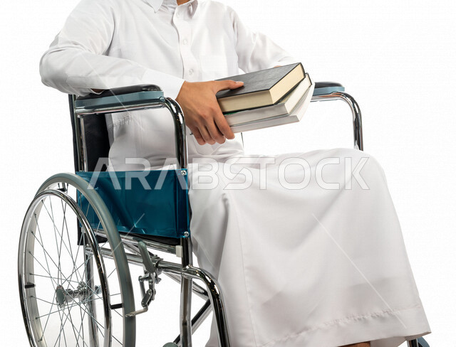 Portrait of a Saudi Arabian Gulf university student sitting in a ...