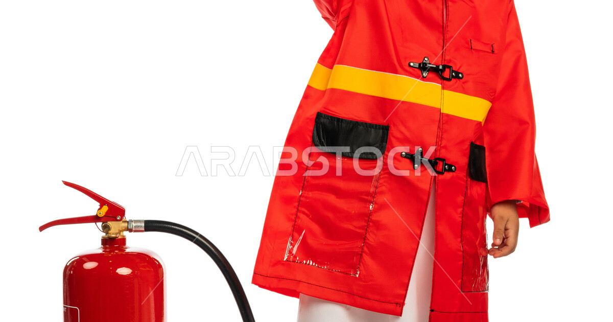 Portrait of a stylish Saudi Arabian Gulf boy, dressed as a fireman ...