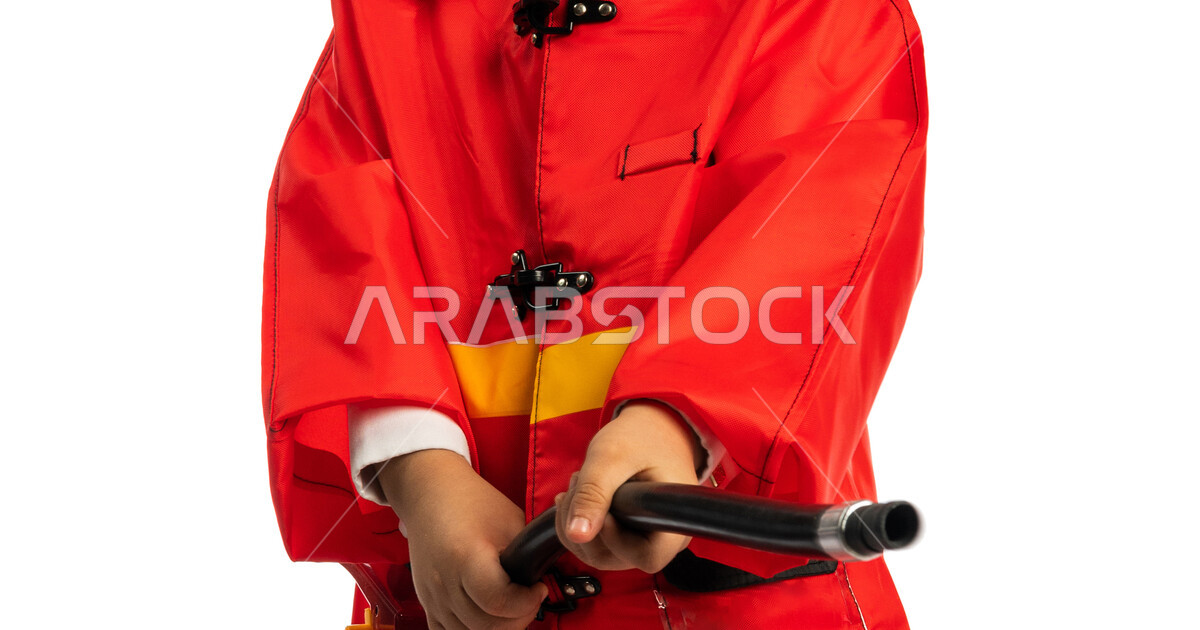 Portrait of a stylish Saudi Arabian Gulf boy, dressed as a fireman ...