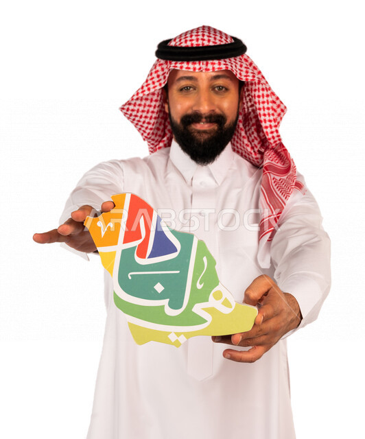 Portrait of a Saudi Gulf man in Saudi uniform, holding in his hand the ...