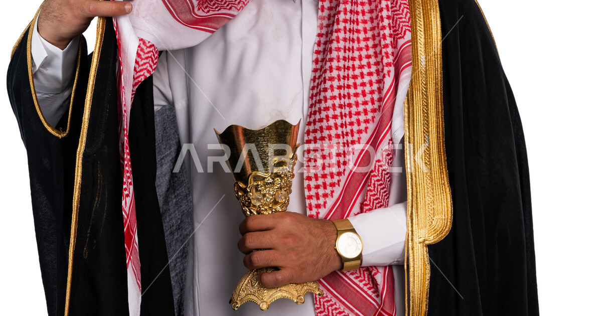 A portrait of a Saudi Arab groom holding an incense holder (censer ...