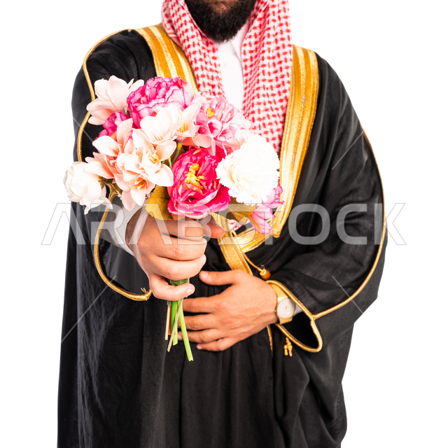 A close-up portrait of a Saudi Arabian Gulf groom in a black pisht ...