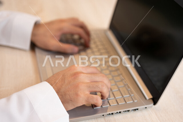 A close-up of the hand of a Saudi Arabian Gulf man, business management ...