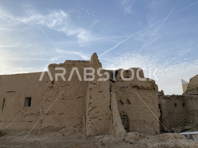Simple mud houses and buildings in Asir city, a brick house in one of ...