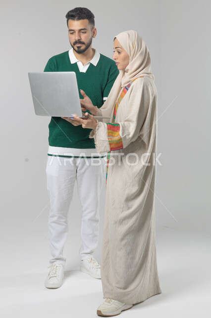 Teamwork and team spirit, portrait of two Saudi Arabian Gulf colleagues ...