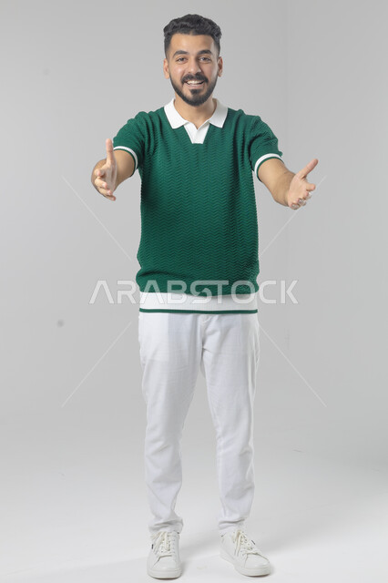 Pointing at something, standing straight and upright, portrait of a ...