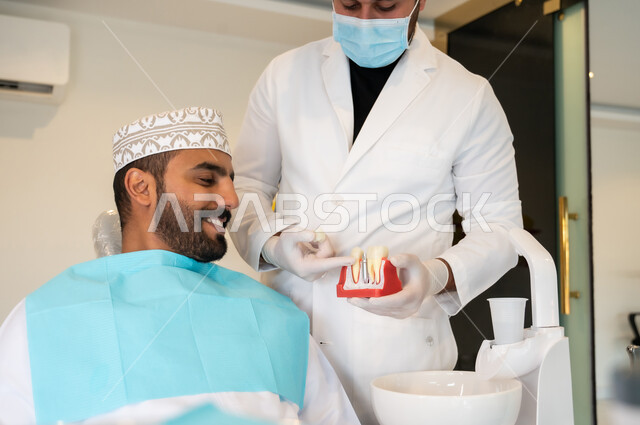 Dental implant to restore natural shape, doctor wearing gloves and ...