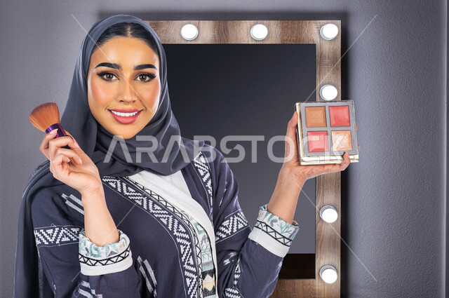 Picture of a Saudi Arabian Gulf woman holding a cosmetic tool (brush ...