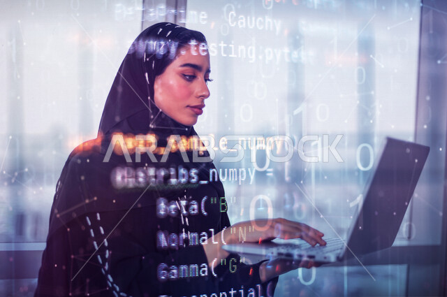 A Saudi Arabian Gulf woman using a laptop, working as a web developer ...