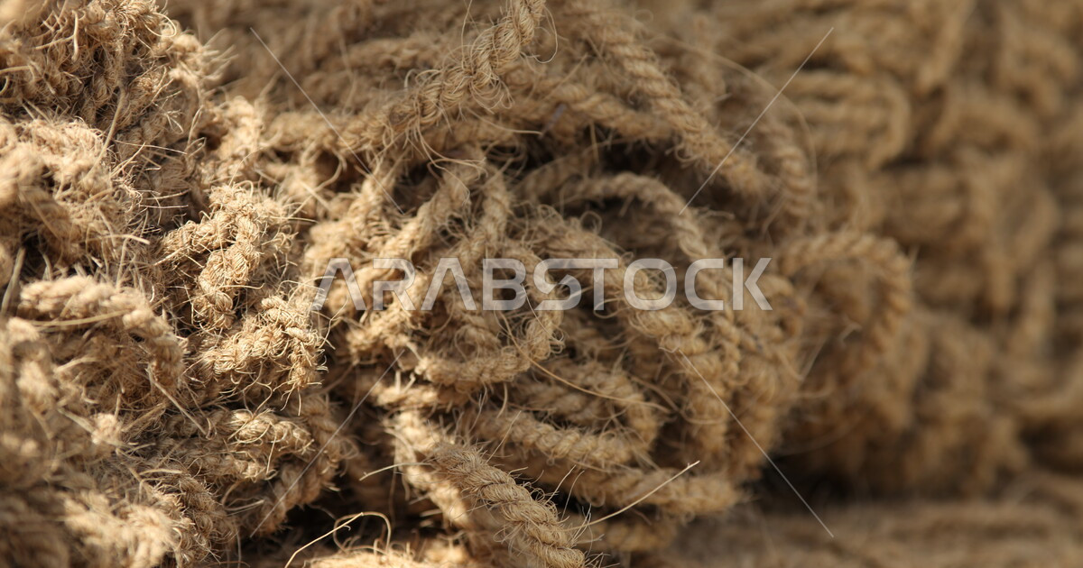 Close-up of a group of coarse ropes, ropes made from the remnants of ...