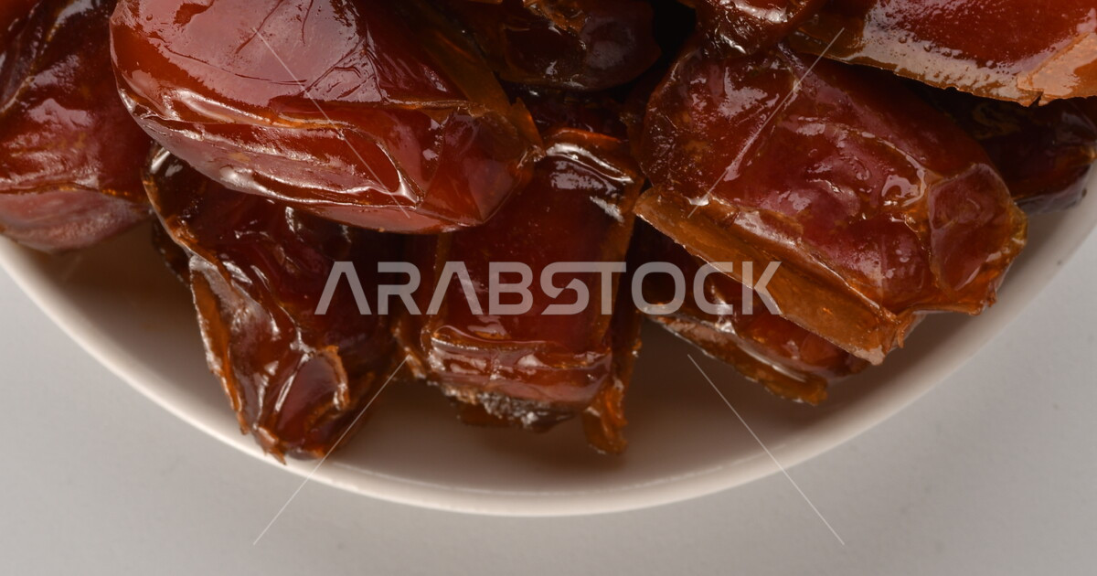a plate full of dates, Khalas dates healthy and delicious dates, a bowl ...