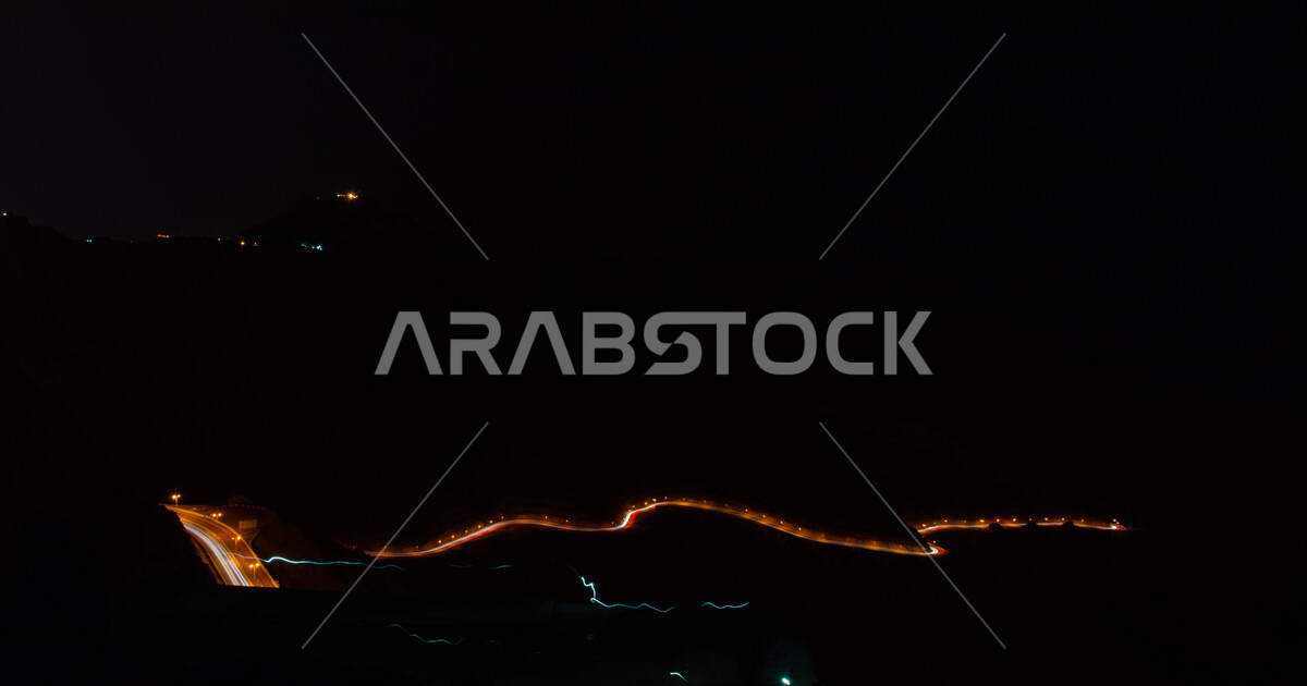 A night view from the top of the Aqabat Al-Hada area in Taif, Saudi ...