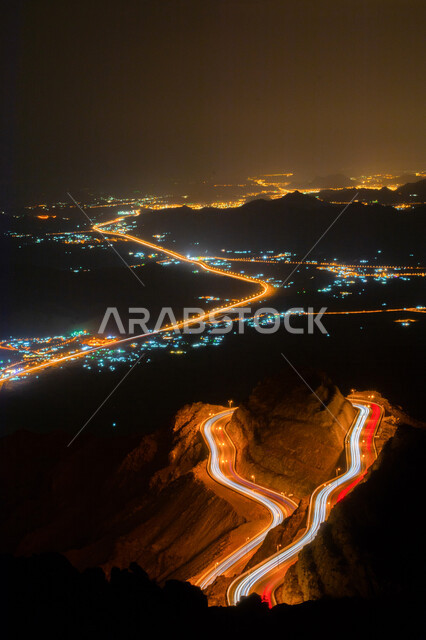 A night view from the top of the Aqabat Al-Hada area in Taif, Saudi ...