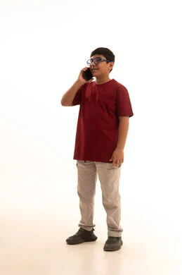 A Saudi Arabian Gulf Arab man dressed in casual attire is making a ...