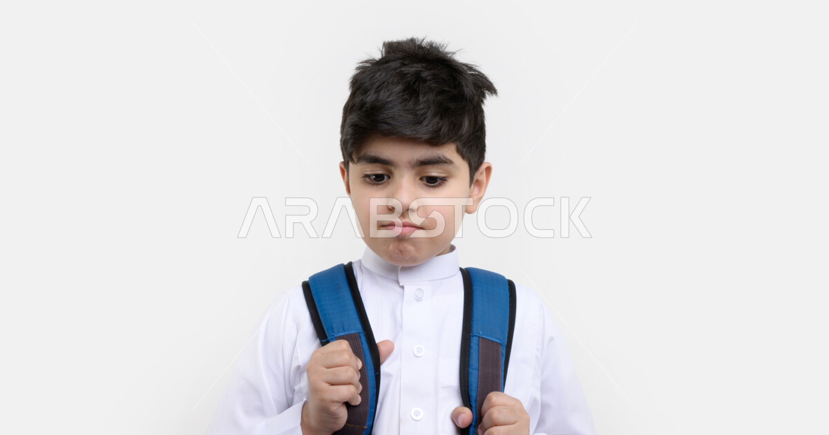 Portrait of a Saudi Arabian Gulf student, wearing a school backpack ...