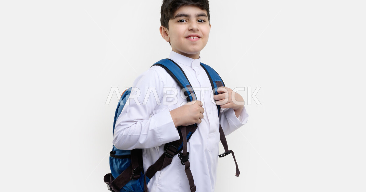 Portrait of a smiling Saudi Arabian Gulf student, wearing a school ...