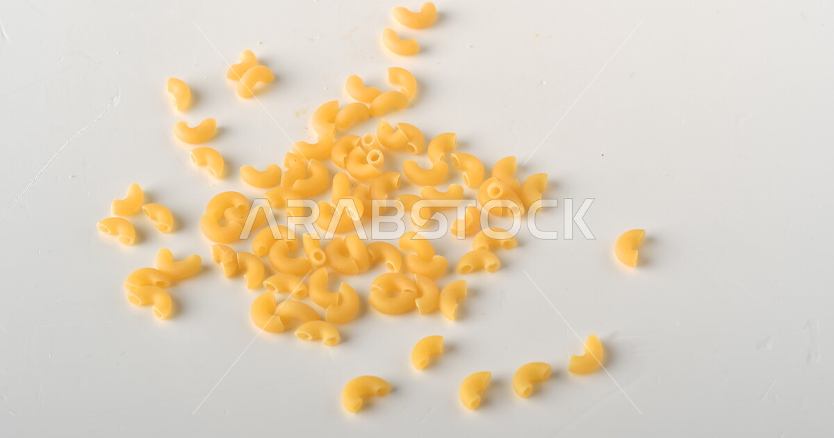 Scattered dry pasta pieces, delicious pasta granules, scattered dry ...