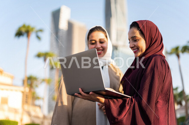 Gulf Saudi Arabian businesswomen using laptop computers in King ...