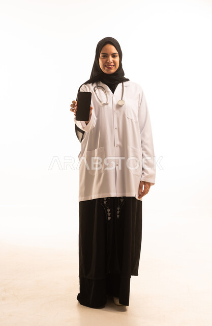 A black screen display, a portrait of an Arab Gulf Saudi female doctor ...