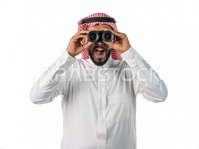 Portrait of a Saudi Gulf man, wearing traditional Saudi dress, looking ...