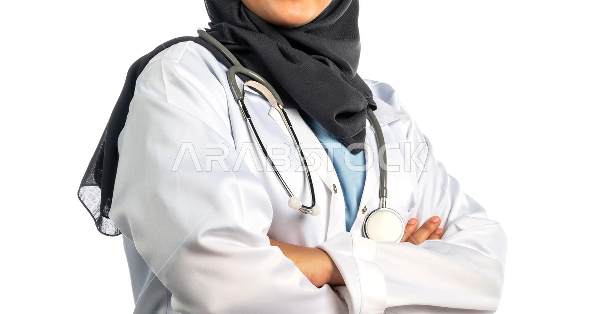 Portrait of a Saudi Arabian Gulf female doctor wearing a medical suit ...