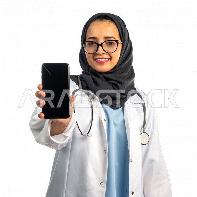 Portrait of a Saudi Arabian Gulf doctor wearing a medical gown, putting ...