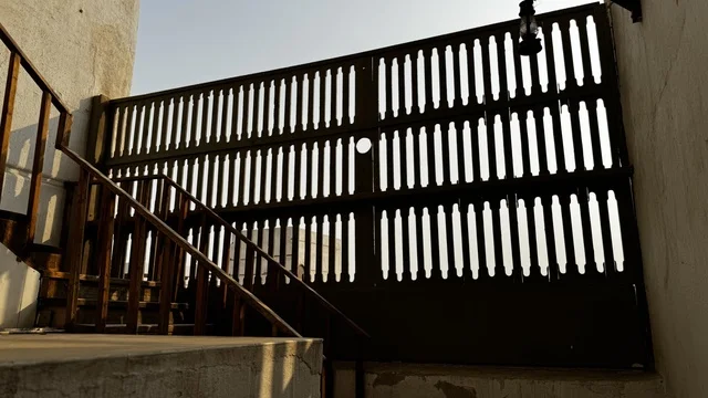 A vertical barrier with openings used for ventilation and privacy ...