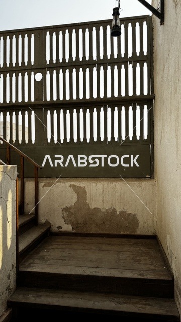 A vertical barrier with openings used for ventilation and privacy ...