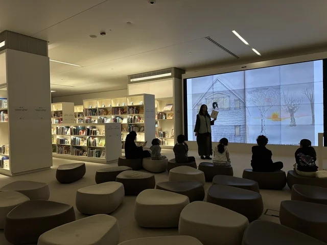 Reading area inside a modern library, digital display screen ...