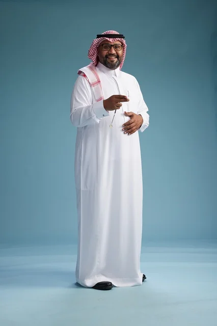 A portrait of an Arab Saudi Gulf man wearing a white thobe and a ...