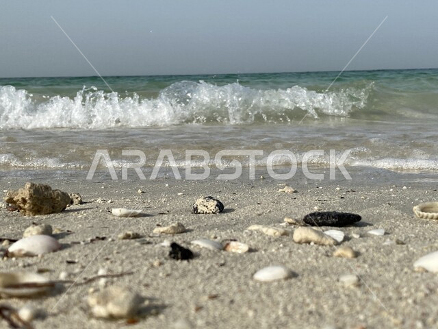 An aesthetic picture of sea waves on the beach of Dammam in Saudi ...