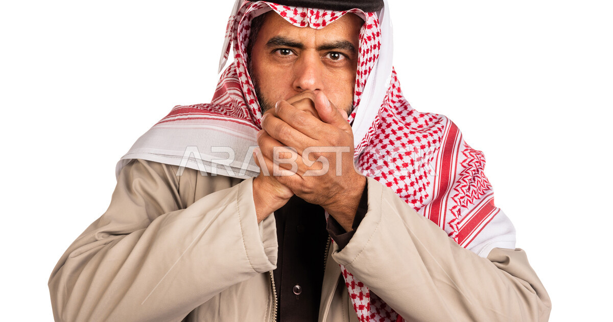 Portrait of a Saudi Arabian Gulf man wearing warm winter clothes and ...