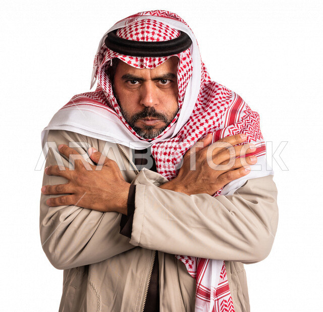 Portrait of a Saudi Arabian Gulf man wearing warm winter clothes and ...