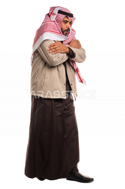 Portrait of a Saudi Arabian Gulf man wearing warm winter clothes and ...
