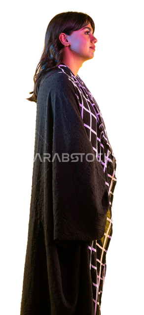 Side view portrait of a smiling Saudi Arabian Gulf Arab woman, wearing ...