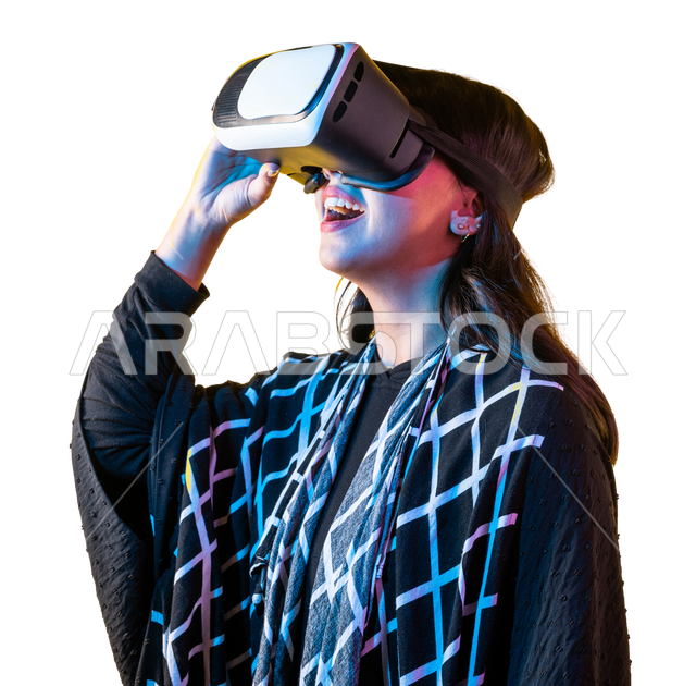 Portrait of a Saudi Gulf woman, wearing virtual reality (VR) 3D glasses ...
