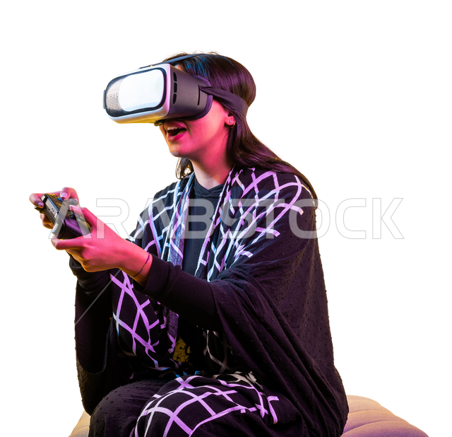 Portrait of a young Saudi Gulf woman, wearing virtual reality (VR) 3D ...