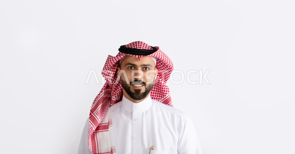 Close-up of a Saudi Arabian Gulf man, a young portrait in traditional ...