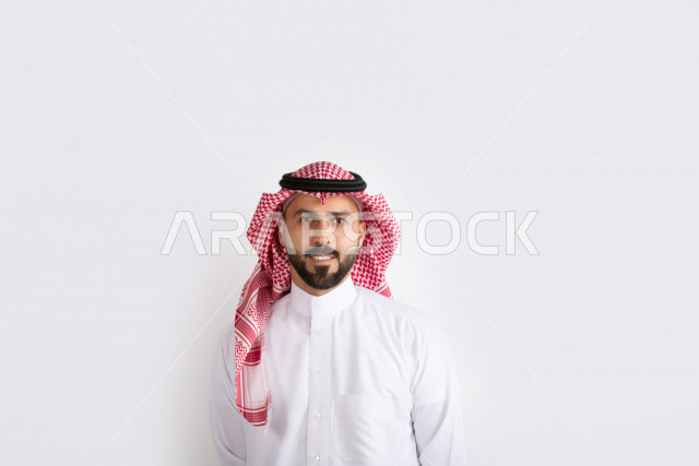 Close-up of a Saudi Arabian Gulf man, a young portrait in traditional ...