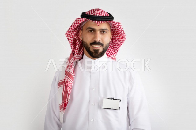 Close-up portrait of a Saudi Gulf Arab man wearing traditional Saudi ...