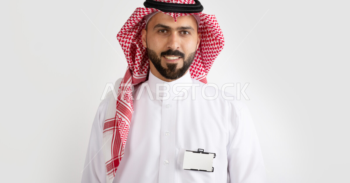 Close-up portrait of a Saudi Gulf Arab man wearing traditional Saudi ...