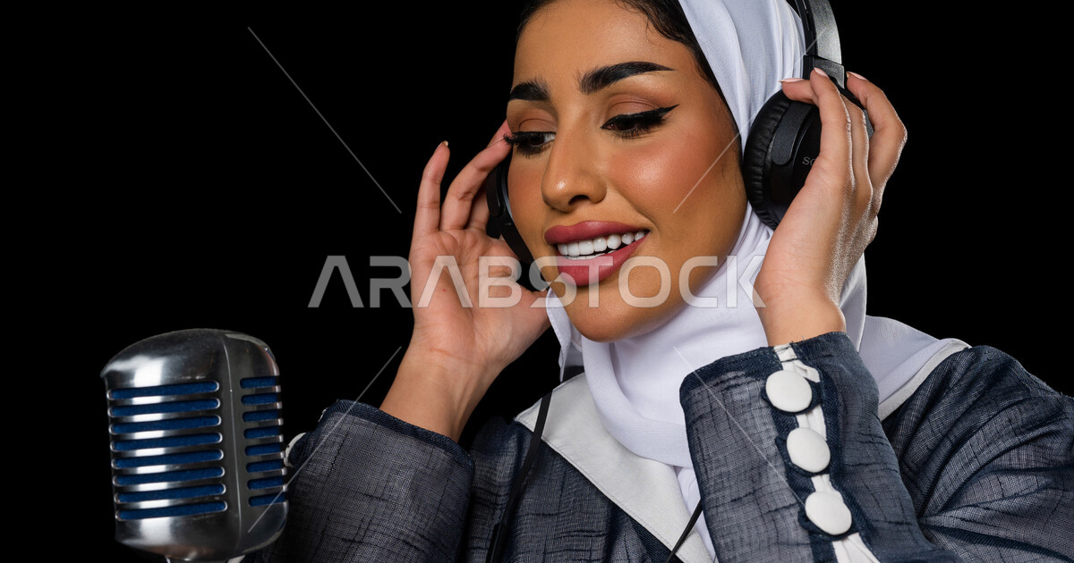 Portrait of a Saudi Arabian Gulf woman in an audio studio, presenting ...