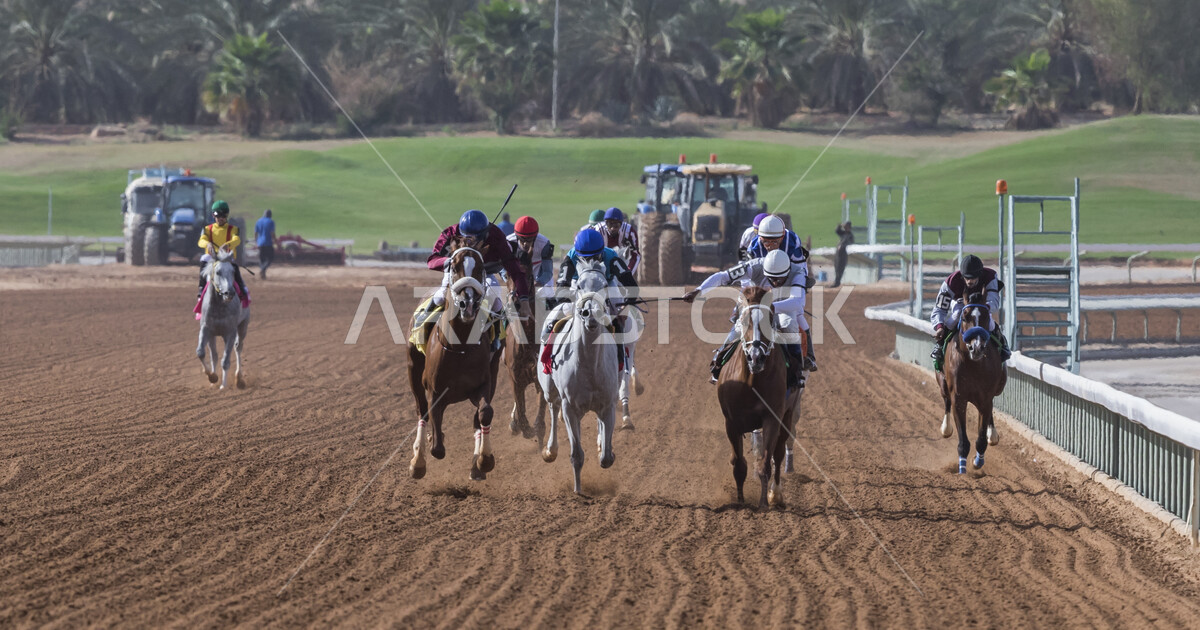 Saudi riders riding horses at high speed on the racetrack, horse racing ...